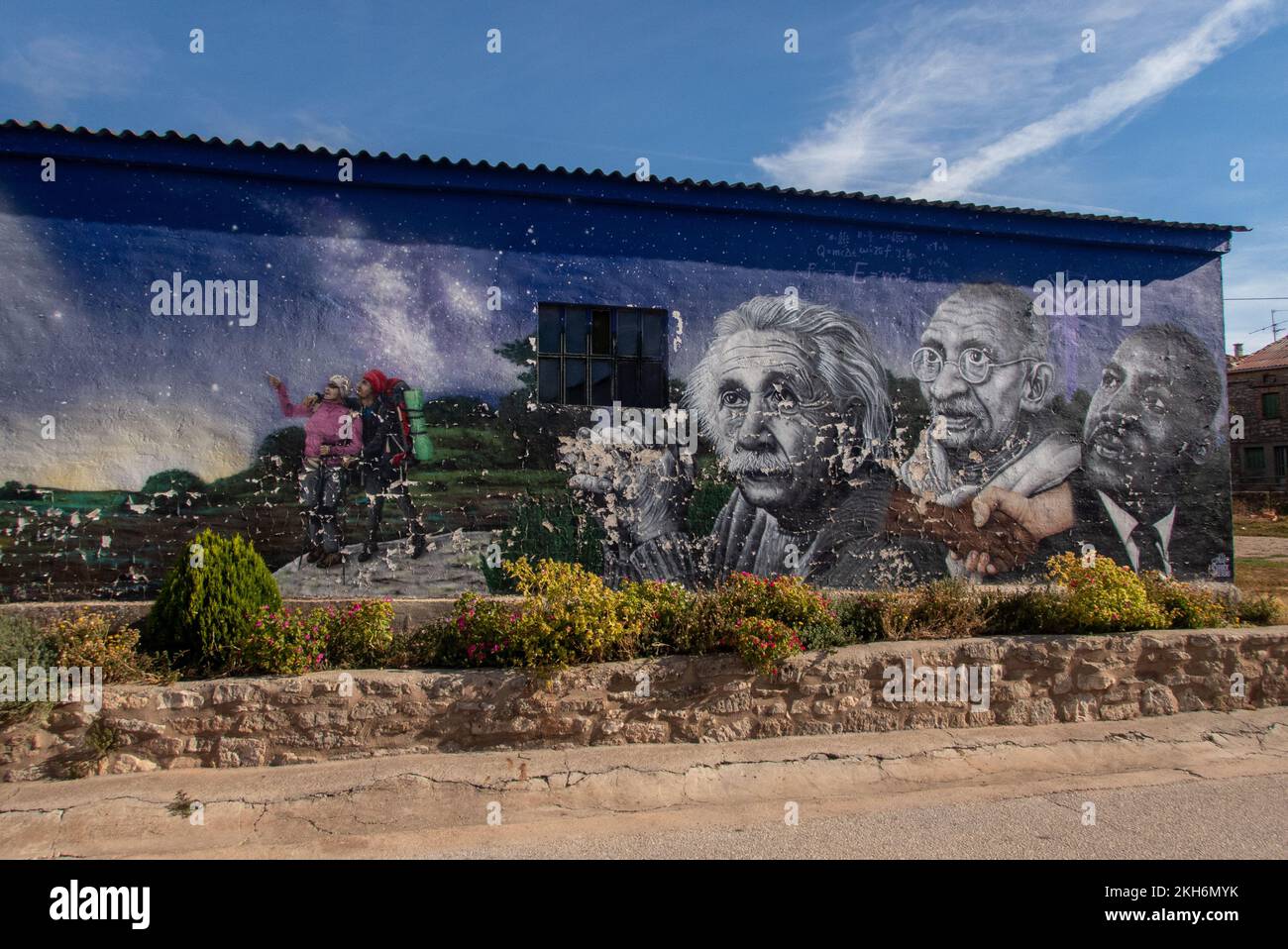 A message of world peace: mural on a barn wall in the village Rabé de ...
