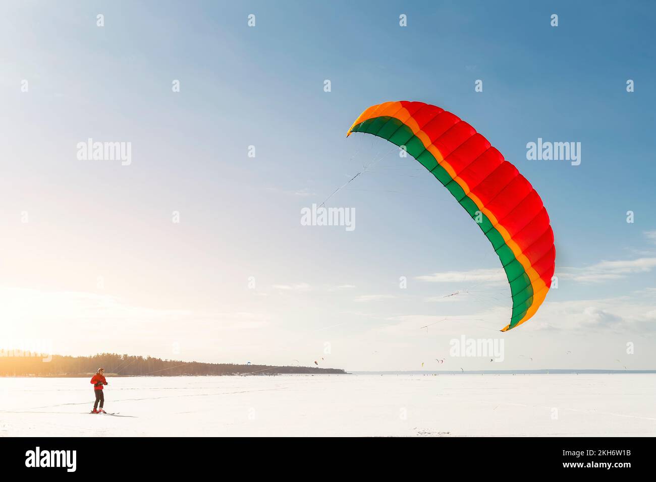 Panoramic view of many people friends enjoy riding kite surf board in ...