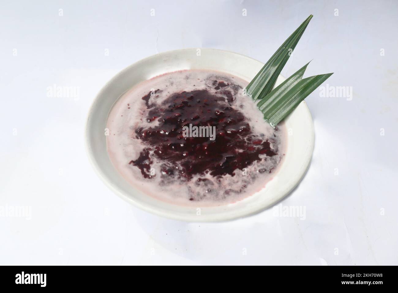 black sticky rice porridge in a bowl. bubur ketan hitam Stock Photo - Alamy