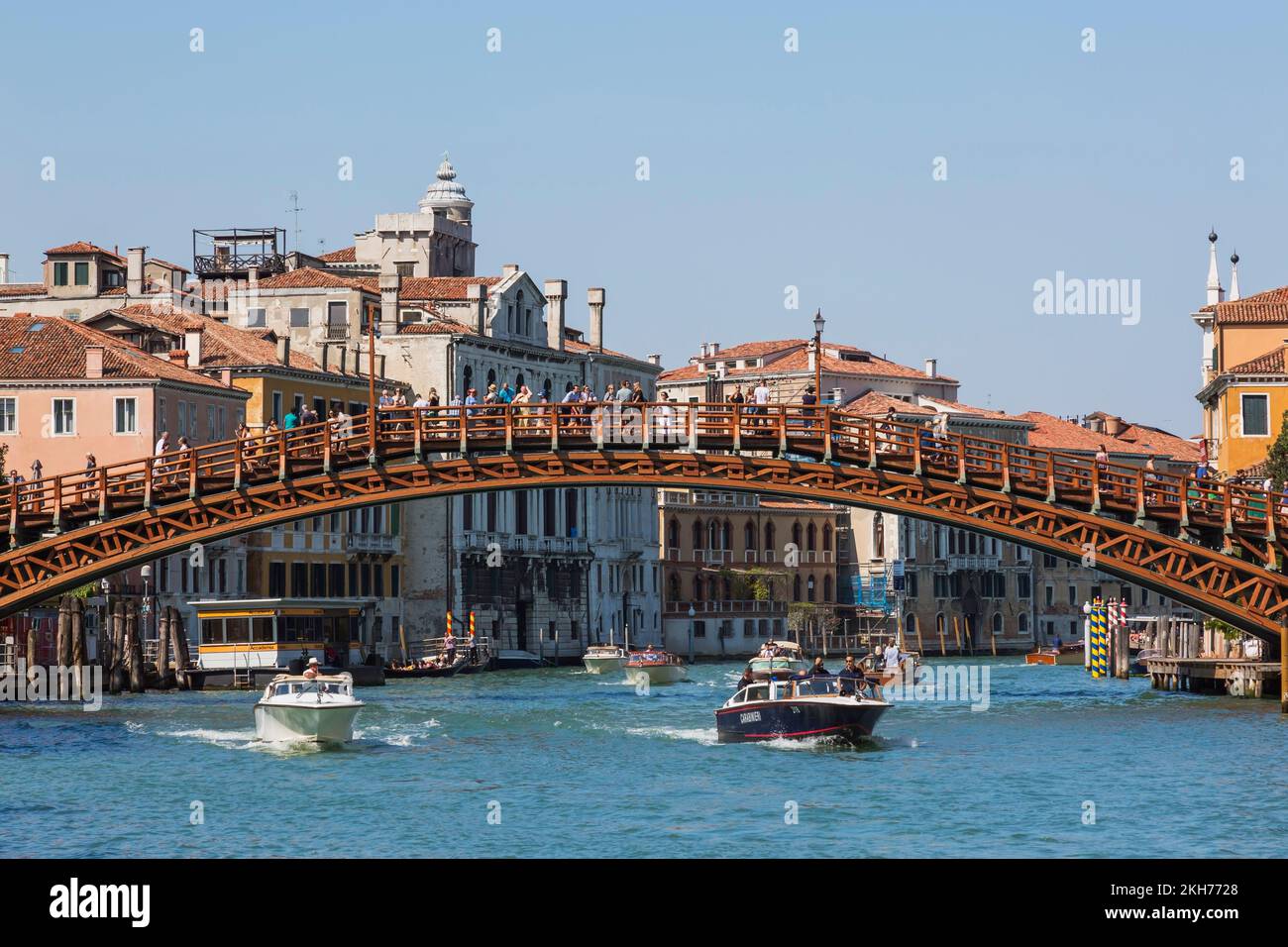 People on Accademia footbridge over Grand canal, carabinieri boat ...