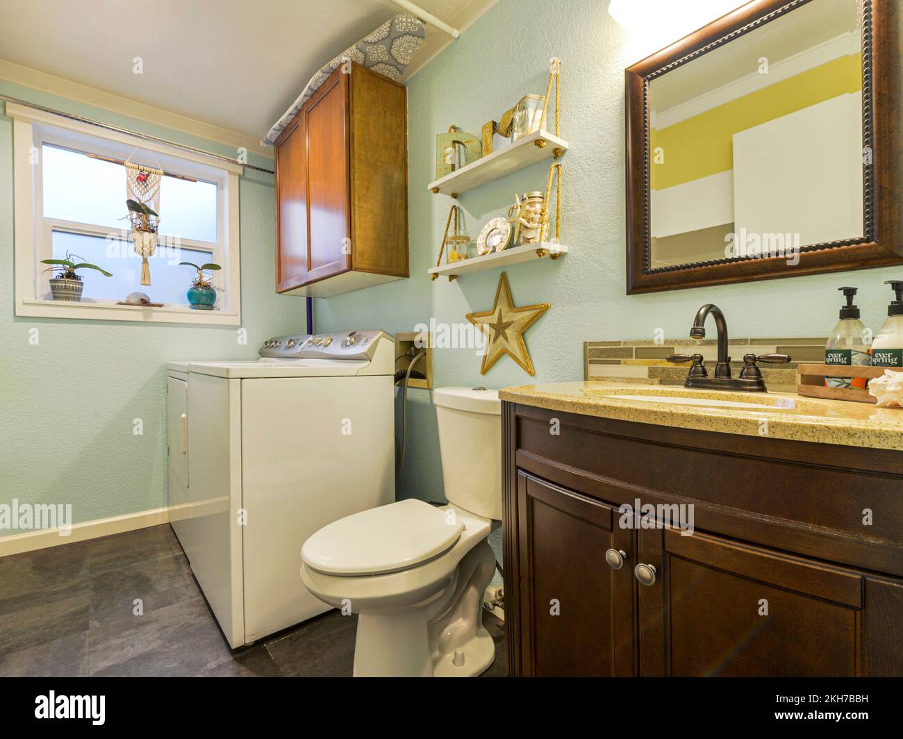 Modern residential bathroom and laundry room interior Stock Photo - Alamy