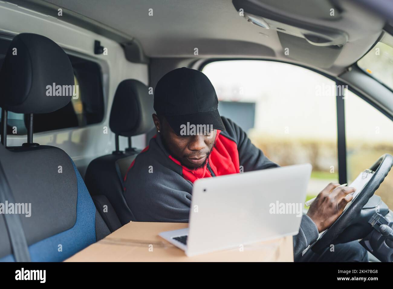Medium closeup shot POV of passenger seat. Adult focused African ...