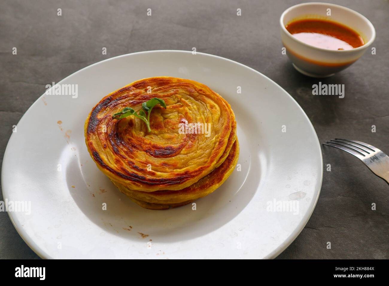 paratha bread or canai bread or roti maryam, favorite breakfast dish ...