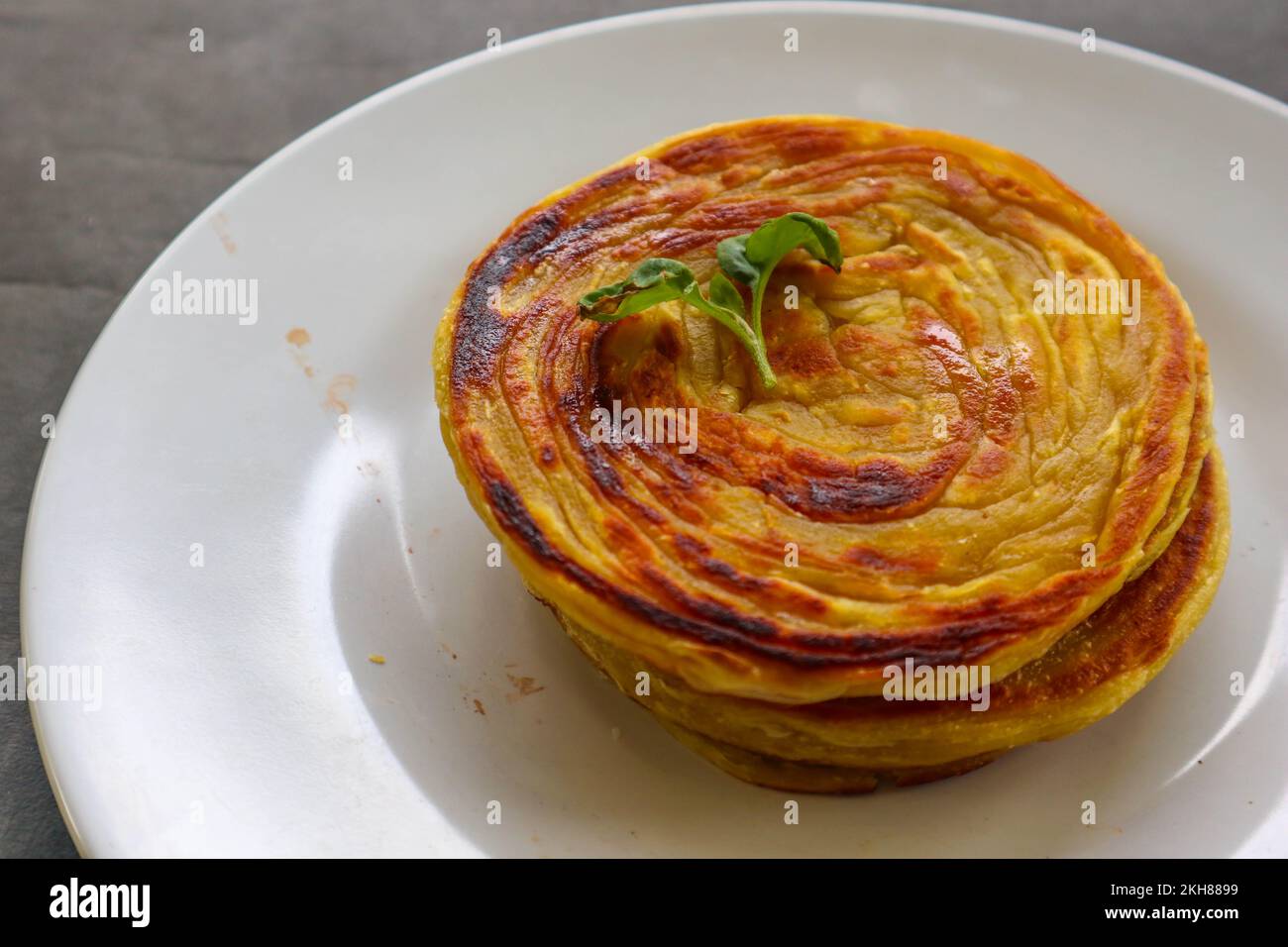 paratha bread or canai bread or roti maryam, favorite breakfast dish ...
