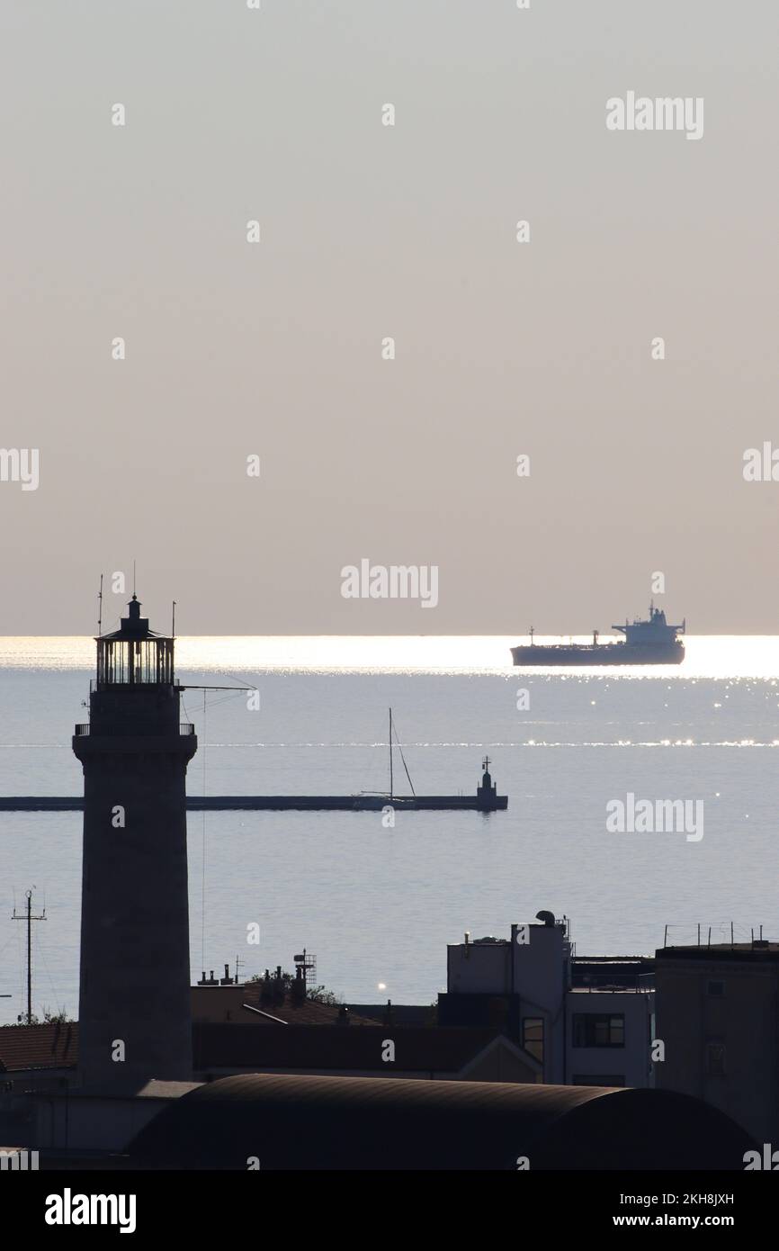 Evening light over Trieste harbour and the “Lanterna di Trieste ...