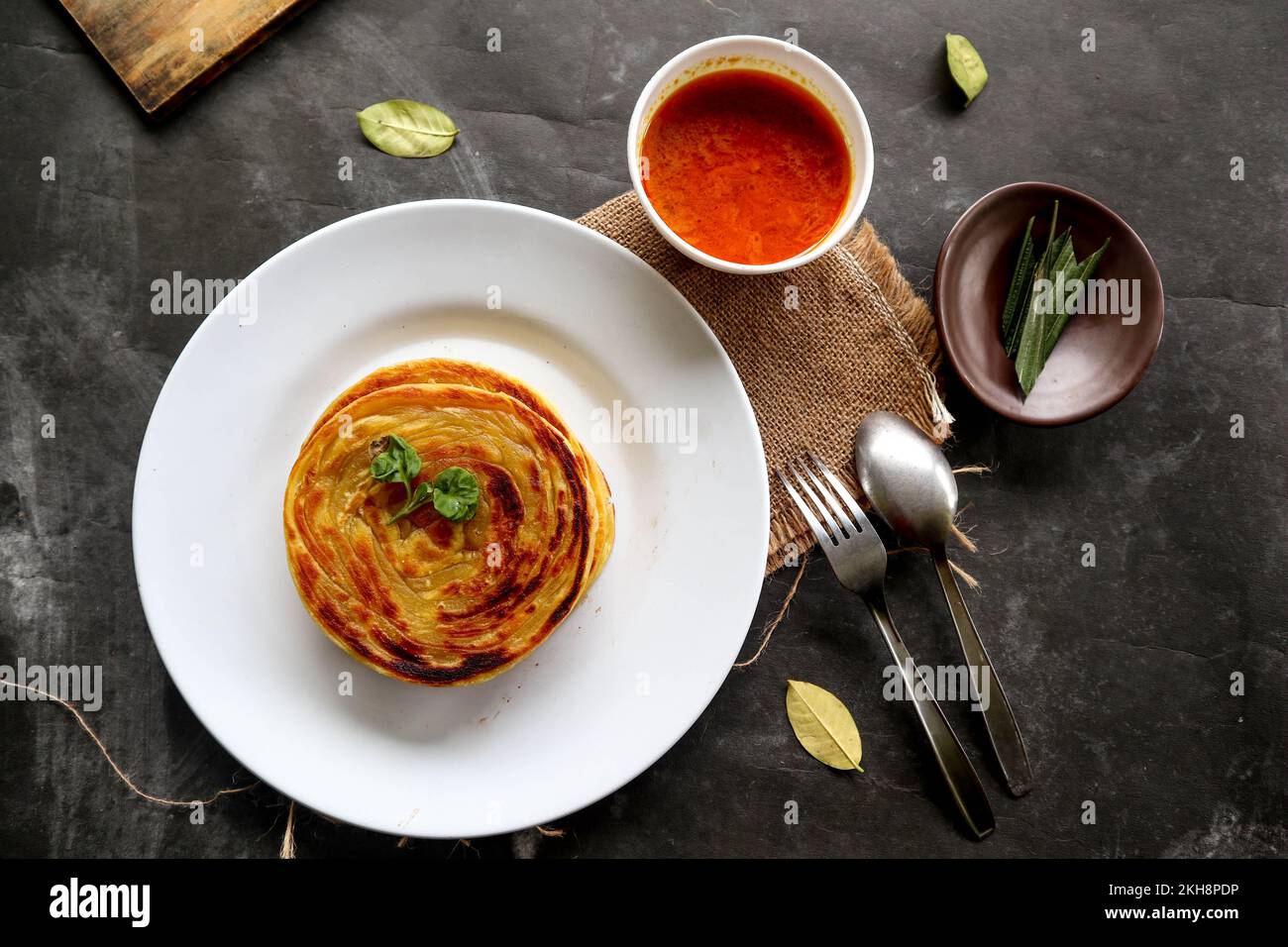 paratha bread or canai bread or roti maryam, favorite breakfast dish ...