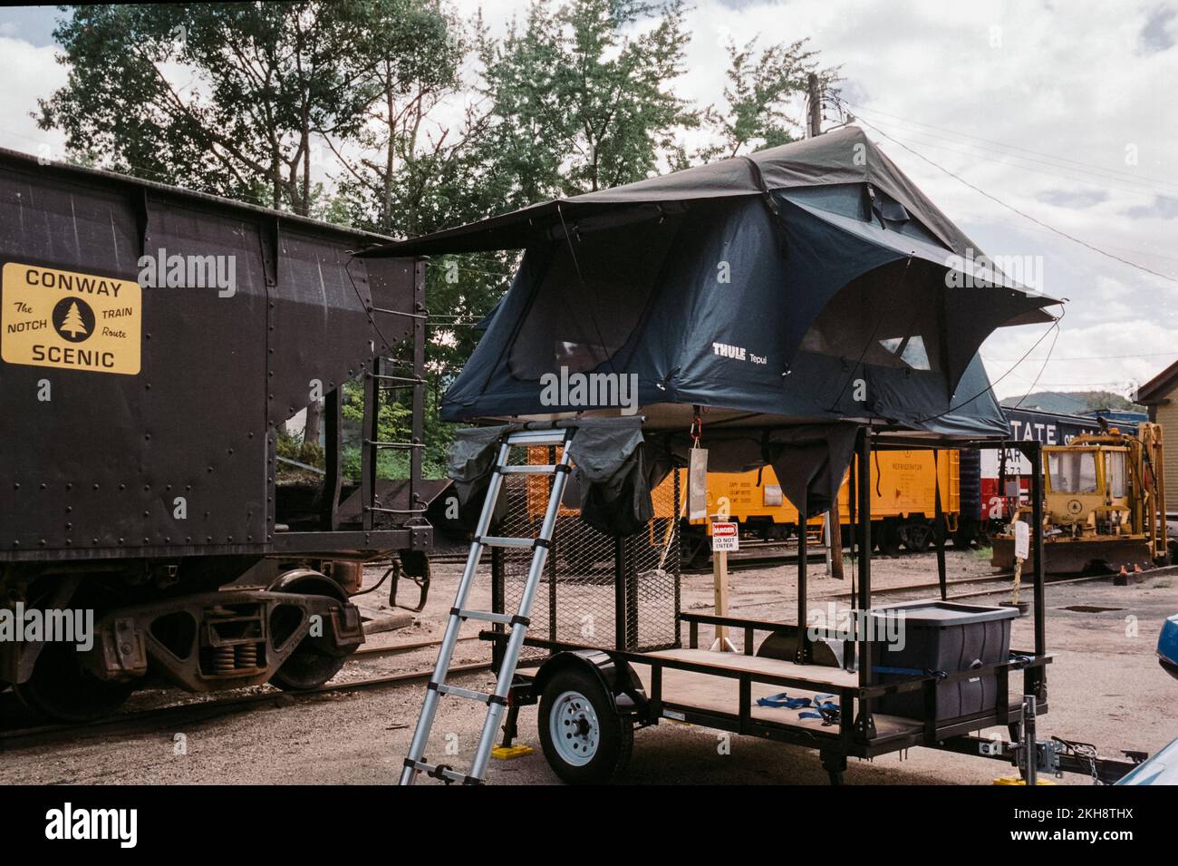 green, red, and gold double-decker passenger car waiting for passengers ...
