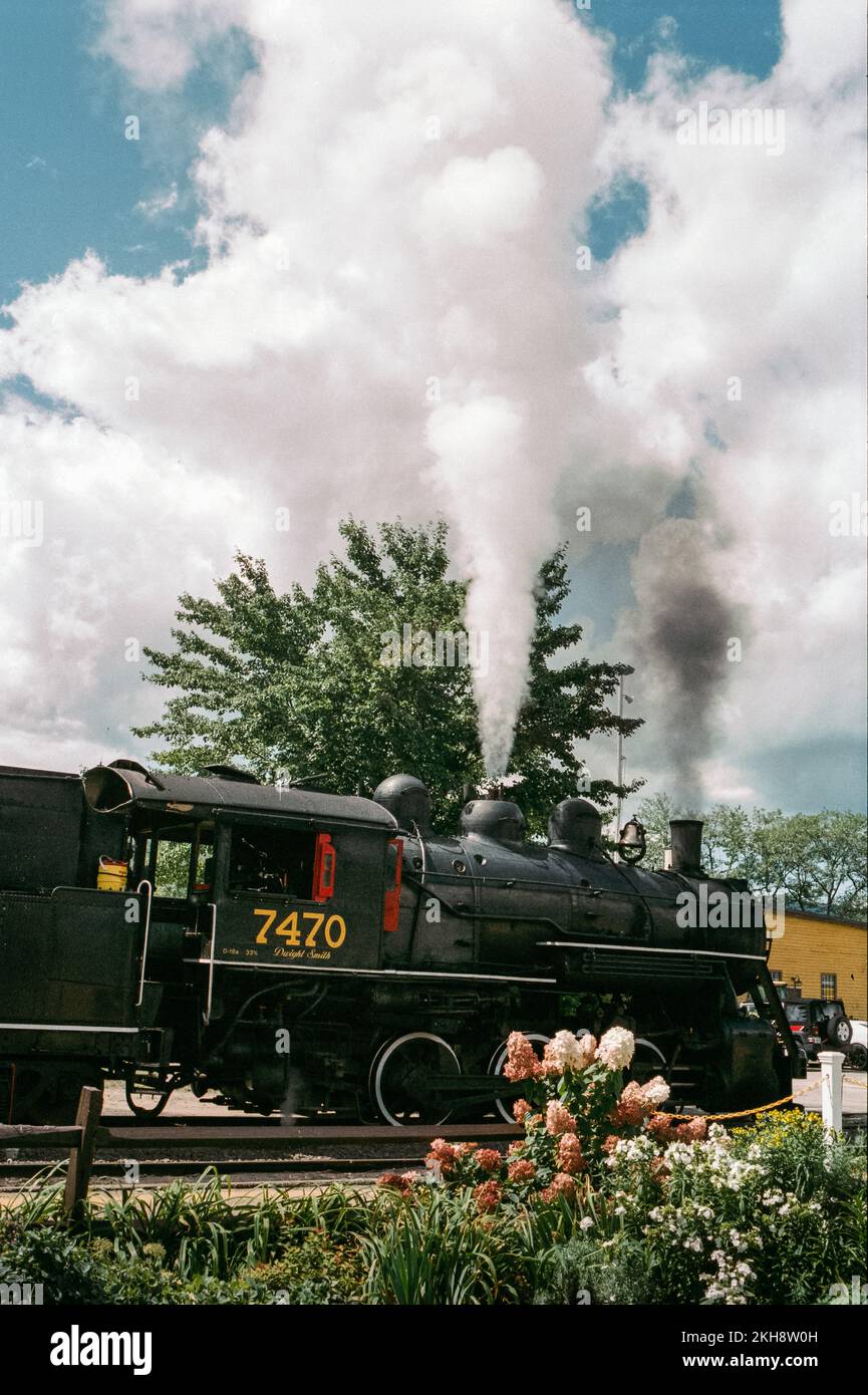 A vintage steam engine chugging smoke into the air outside the Conway ...
