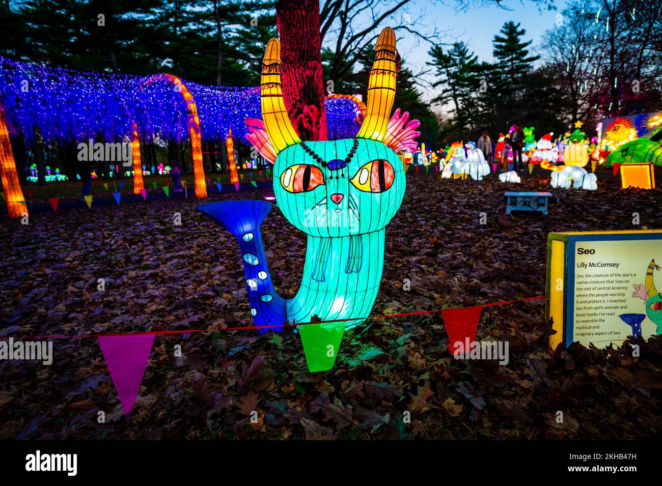 A glowing blue and turquoise cartoonish aquatic creature light statue ...