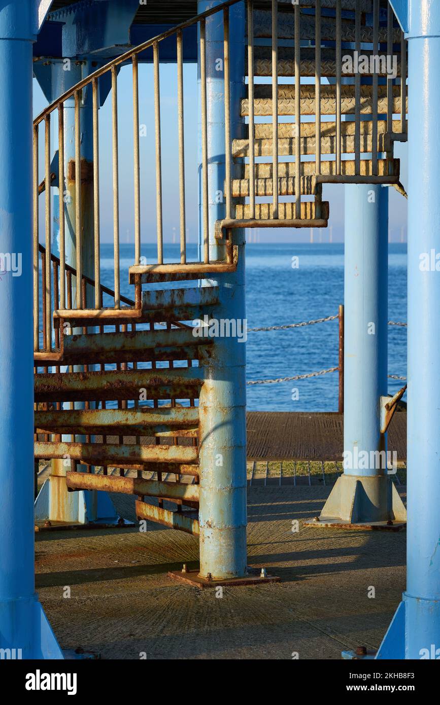 A closeup of stairs with a blue sea in the background Stock Photo - Alamy