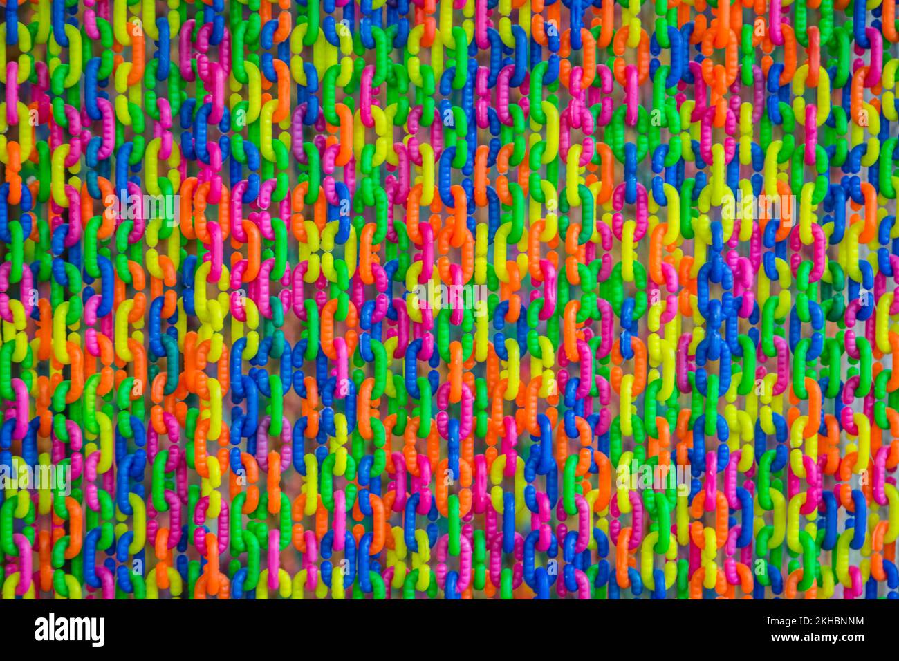 Colorful plastic chain background Stock Photo - Alamy