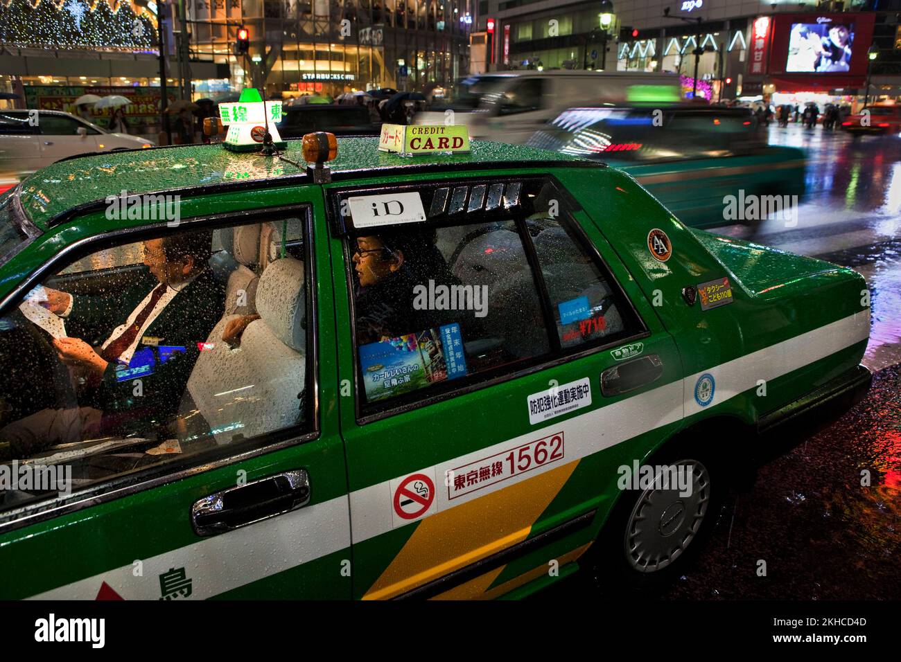 Taxi driver passenger rainy evening Shibuya Tokyo Japan Stock Photo - Alamy