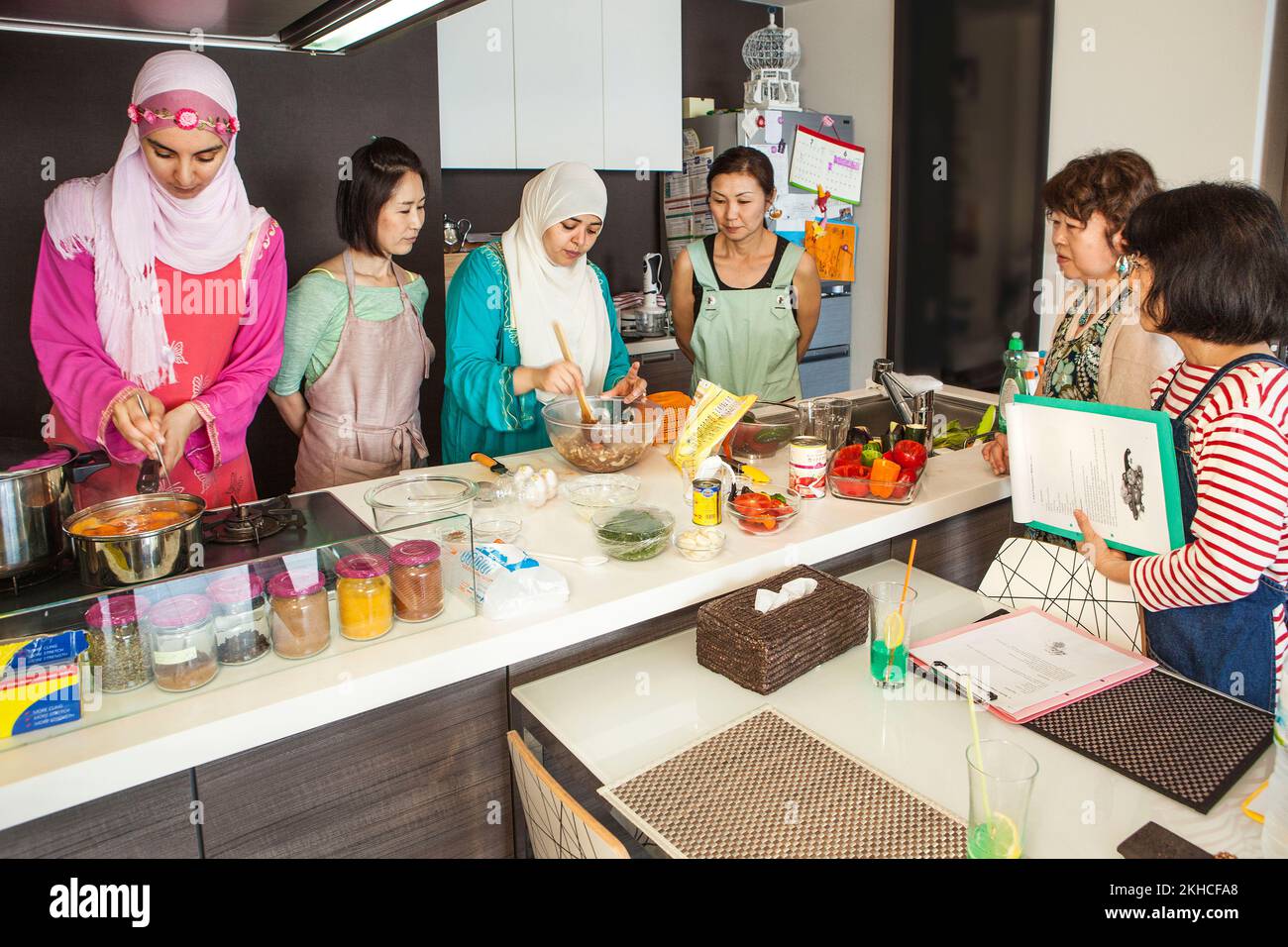 Teachers instruct at Tunisian cooking class, Shibaura, Tokyo, Japan ...