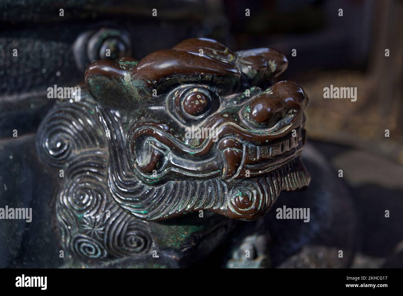 Temple dog guardian figure metal Yushima Shrine Tokyo Japan Stock Photo ...