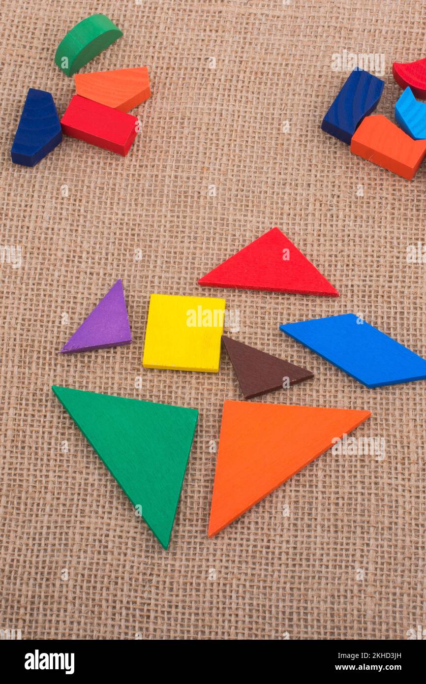 Colorful pieces of a square tangram puzzle Stock Photo - Alamy