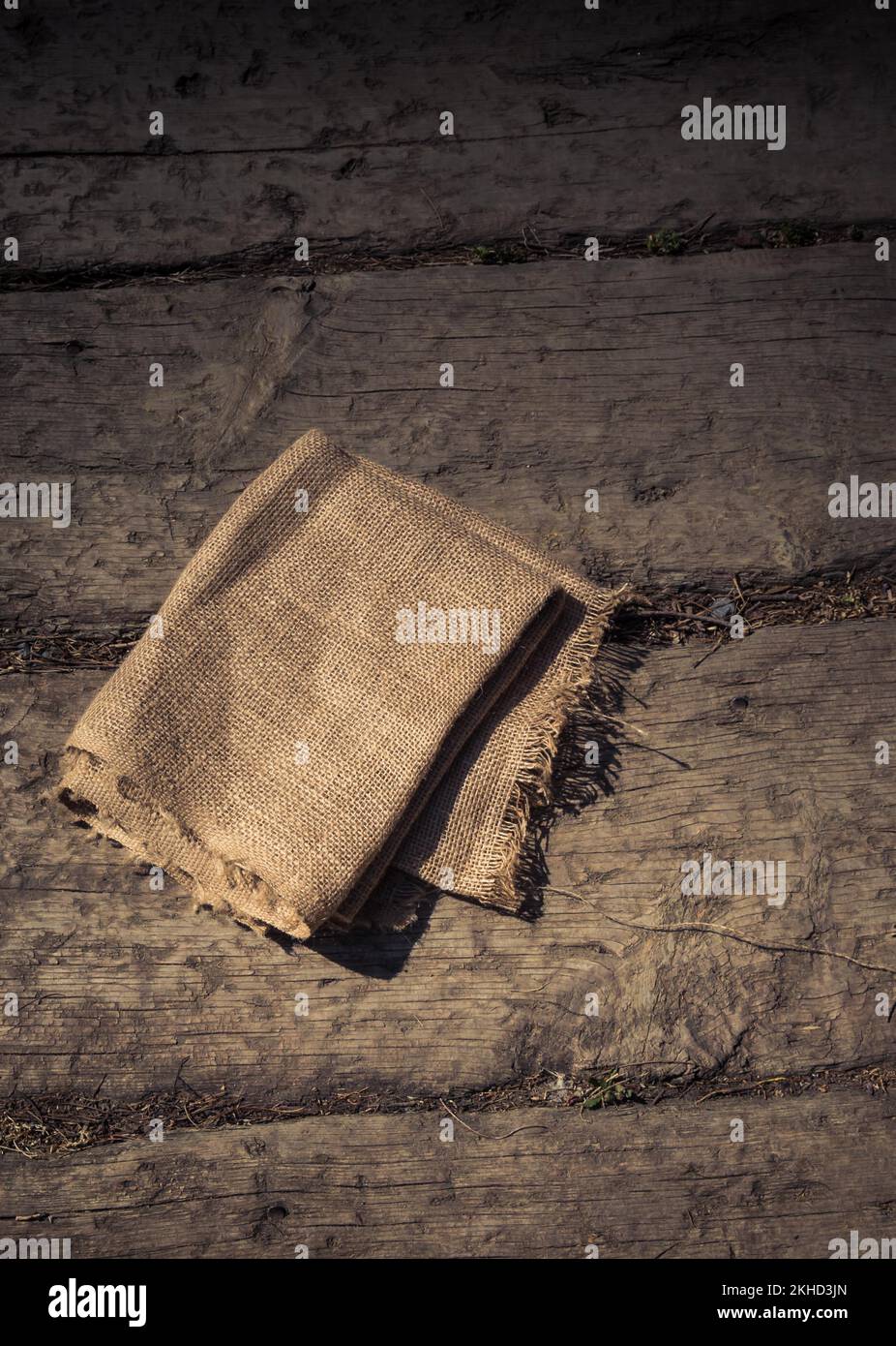 Brown color natural linen texture fabric on wood Stock Photo - Alamy