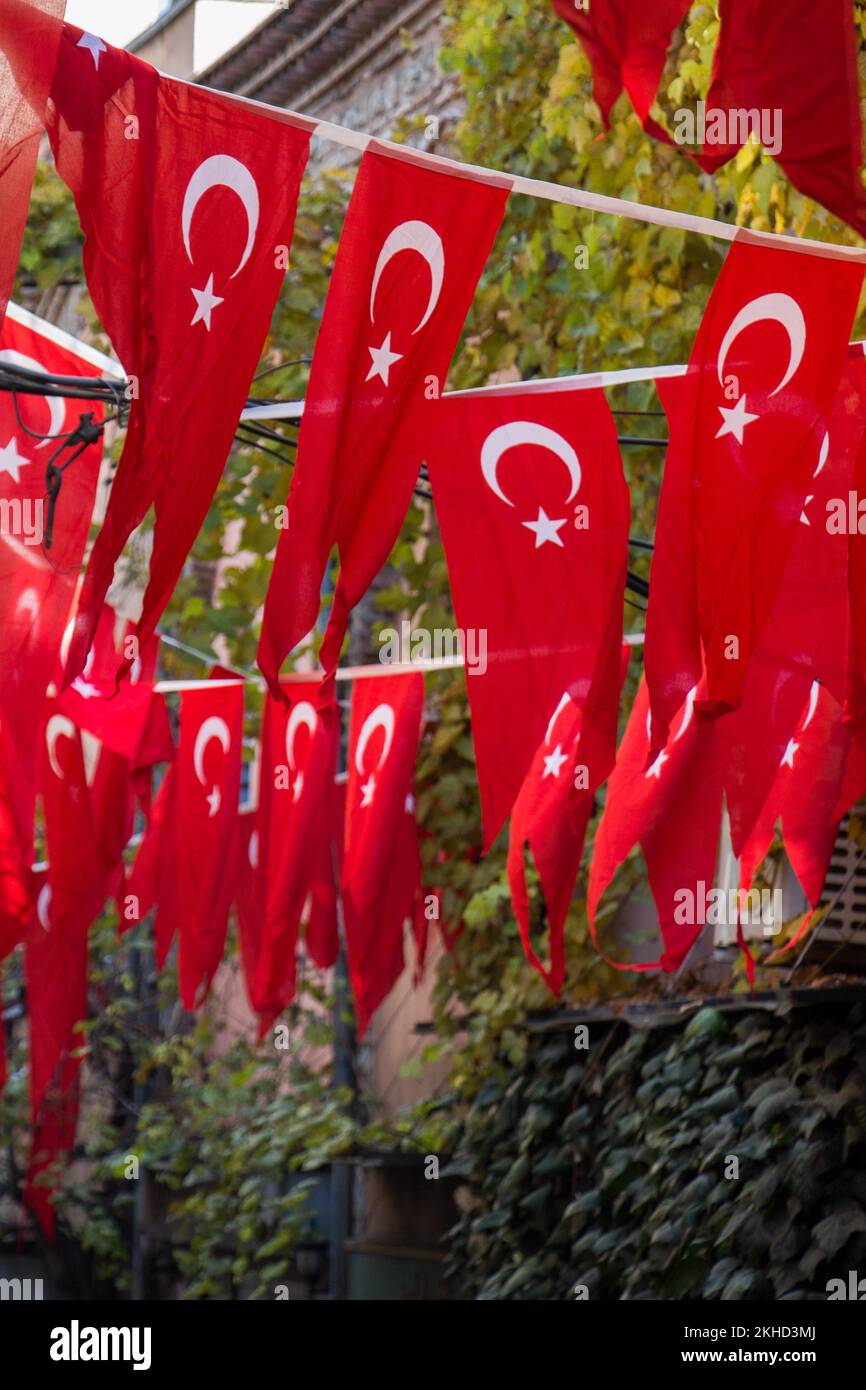 Turkish national flag hang on a pole on a rope in the street in open ...