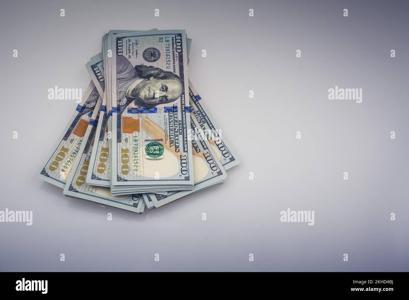 American 100 dollar banknote bundles placed on white background Stock ...