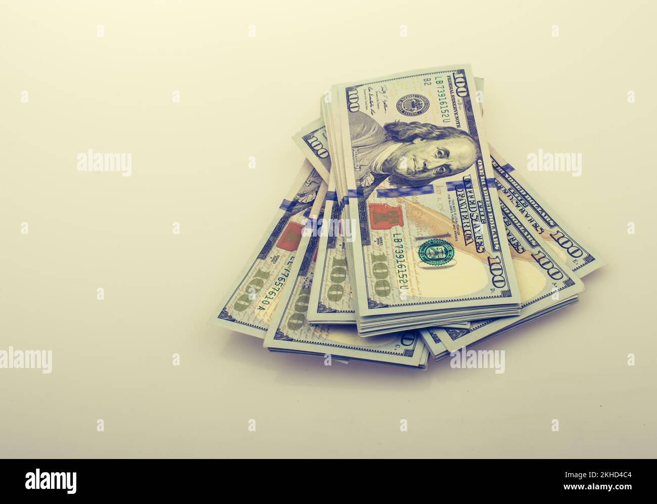 American 100 dollar banknote bundles placed on white background Stock ...