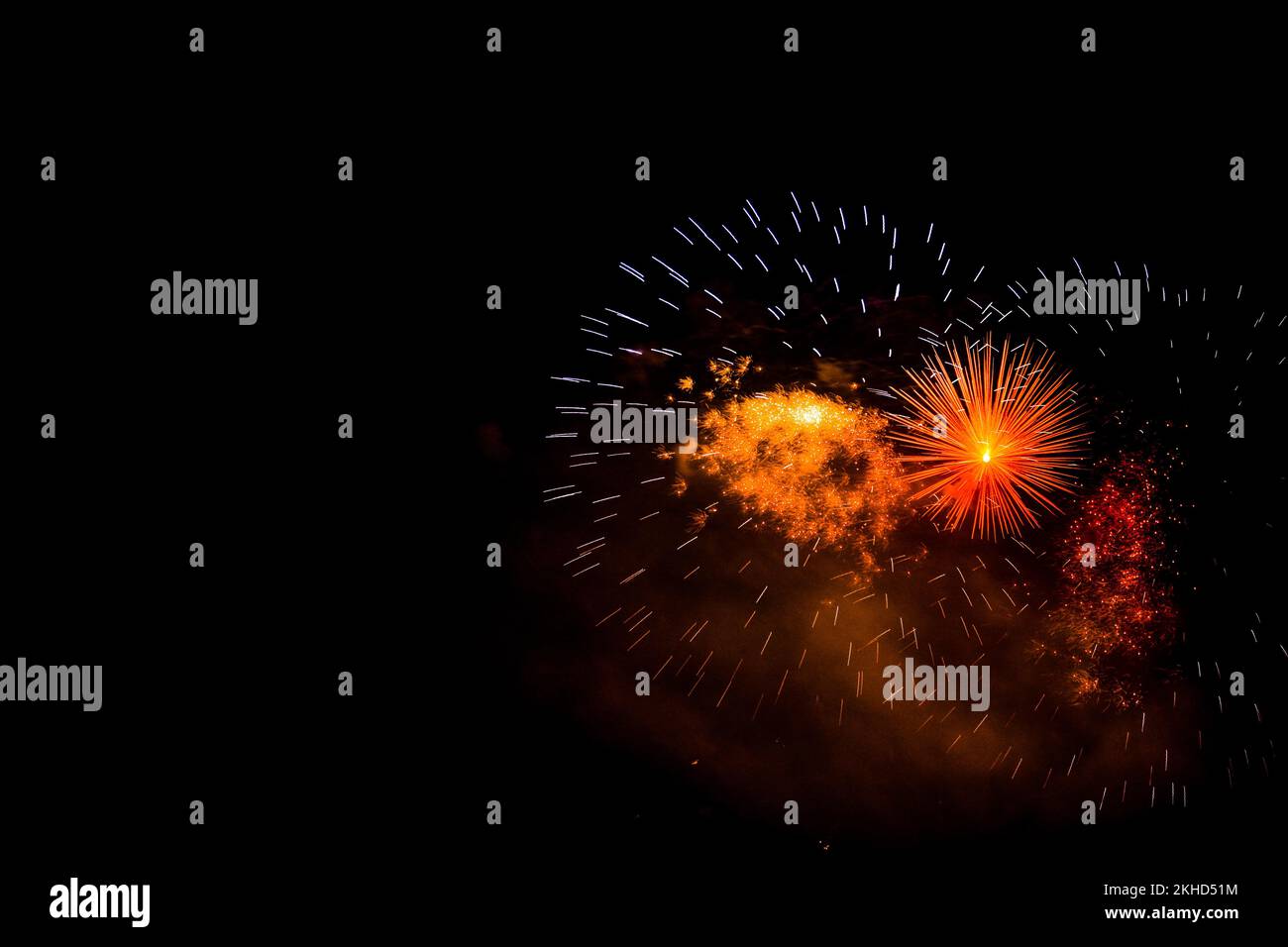 Festive colour firework background at a dark night Stock Photo - Alamy