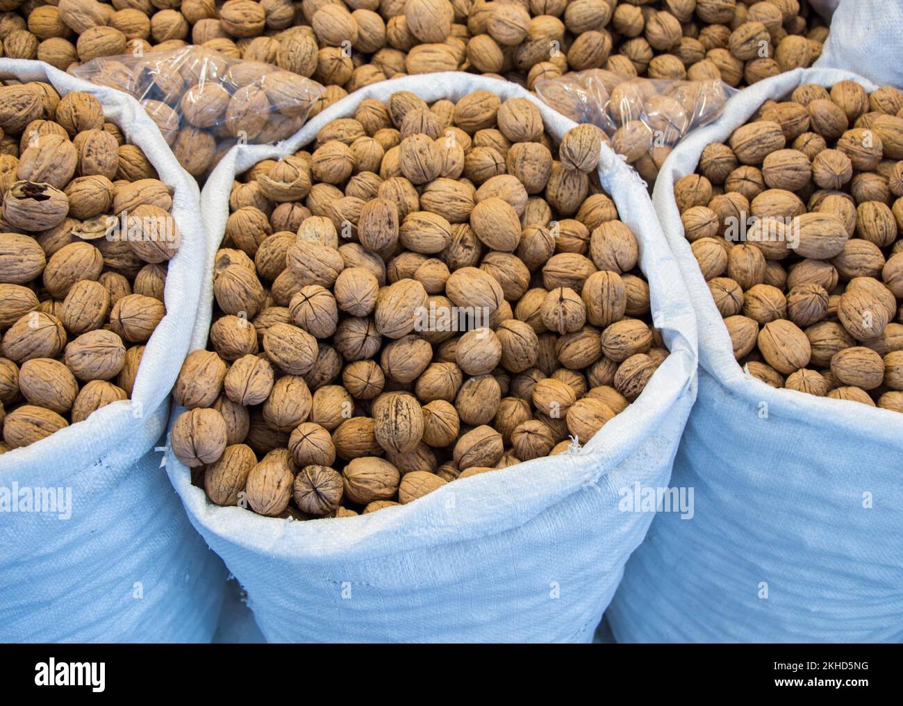 Sack of whole fresh walnuts with hard nutshells Stock Photo - Alamy