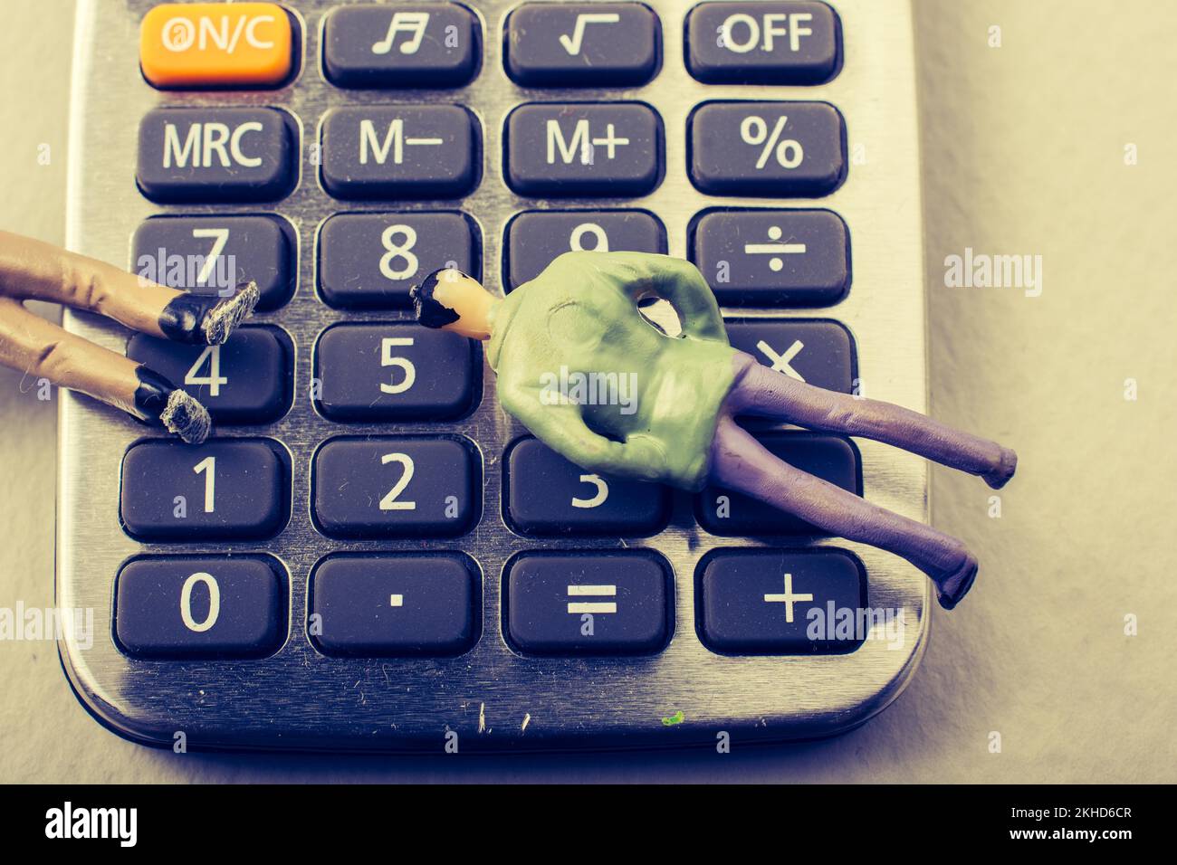 Men figurine on Calculator device with a keyboard and display Stock ...
