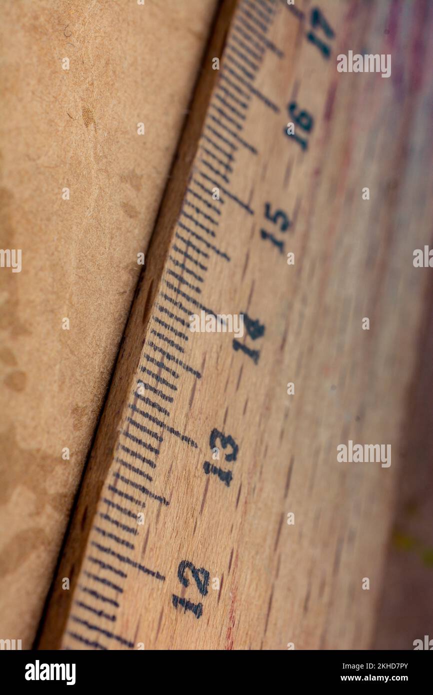 Part of ruler made of wood in close up view Stock Photo - Alamy