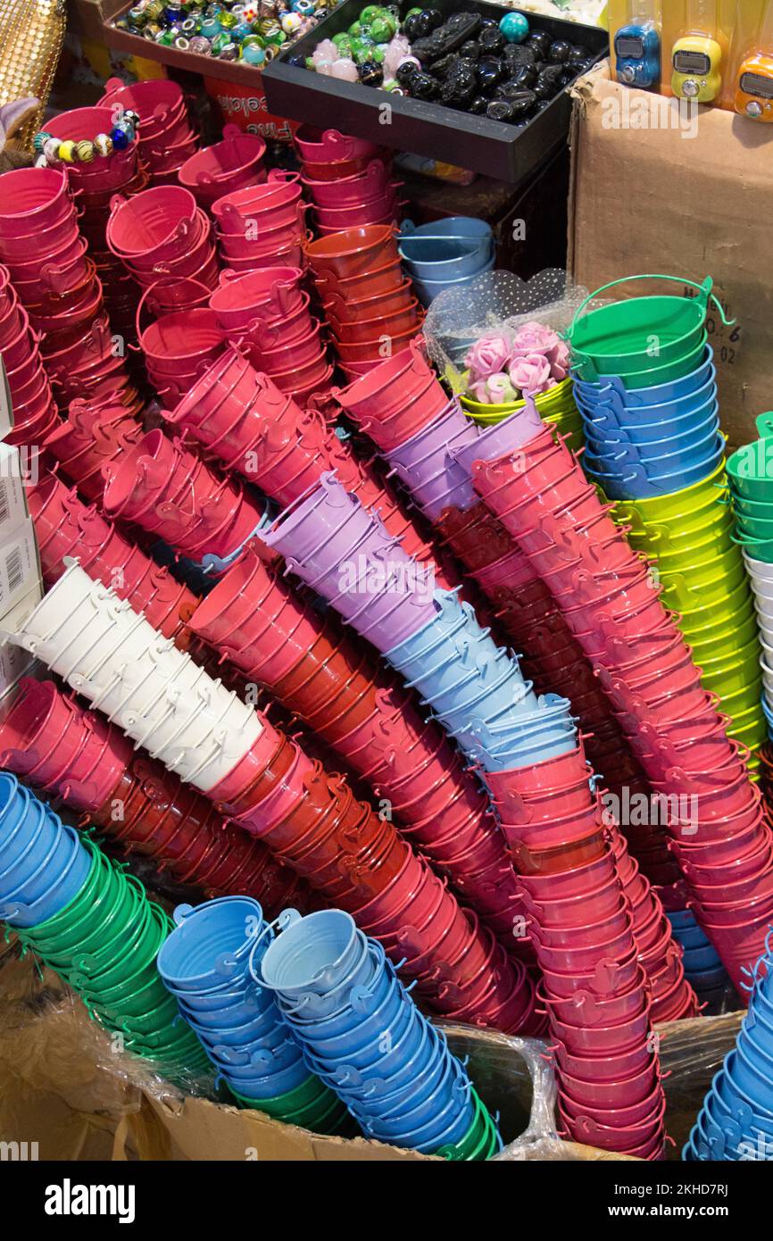 Little set of buckets of various colors in a market place Stock Photo ...