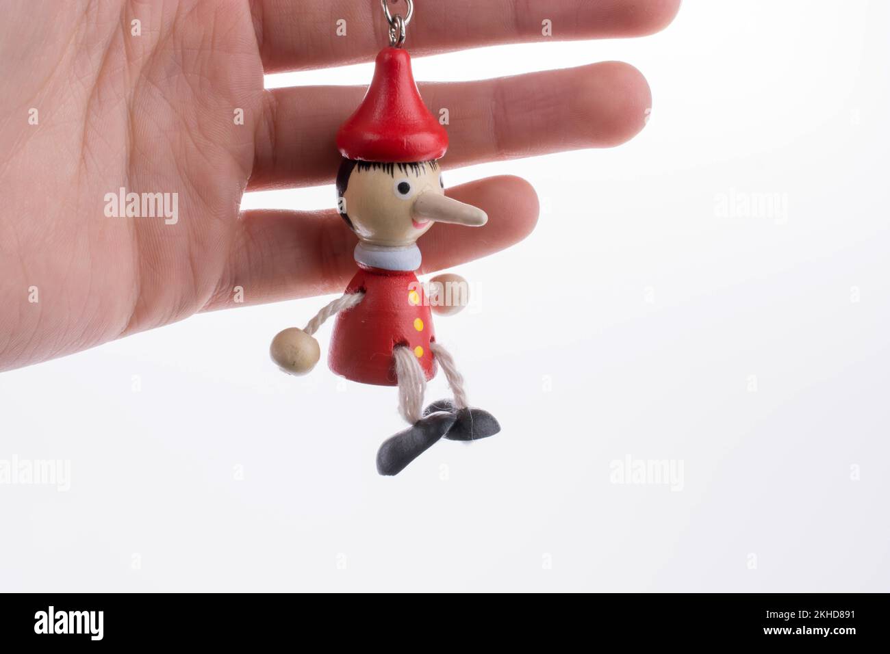 Wooden pinocchio doll with his long nose on a white background Stock ...