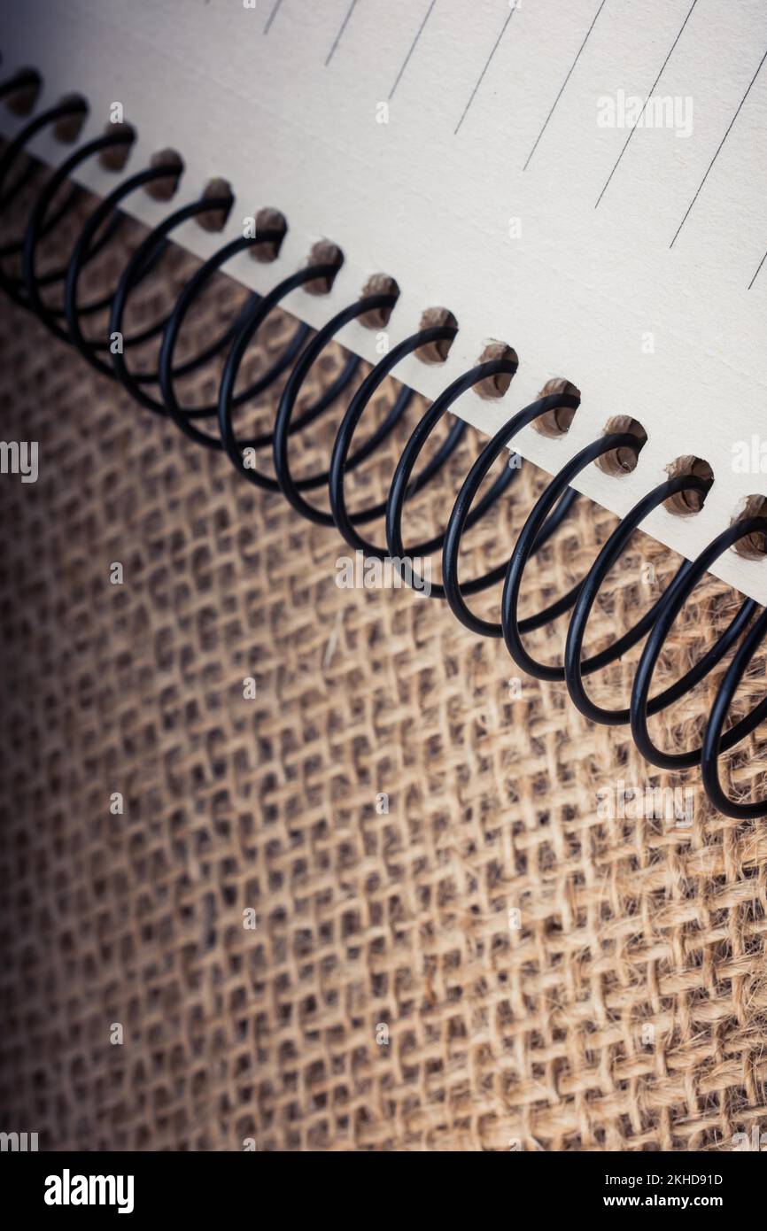 Brown color spiral notebook placed on a canvas background Stock Photo ...