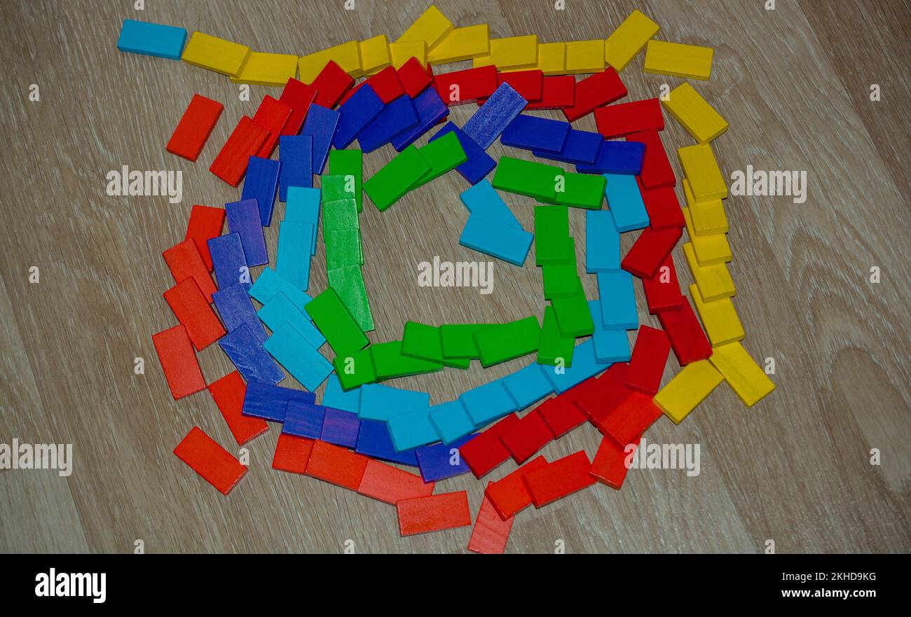 Colorful Domino Blocks in a line on a white background Stock Photo - Alamy