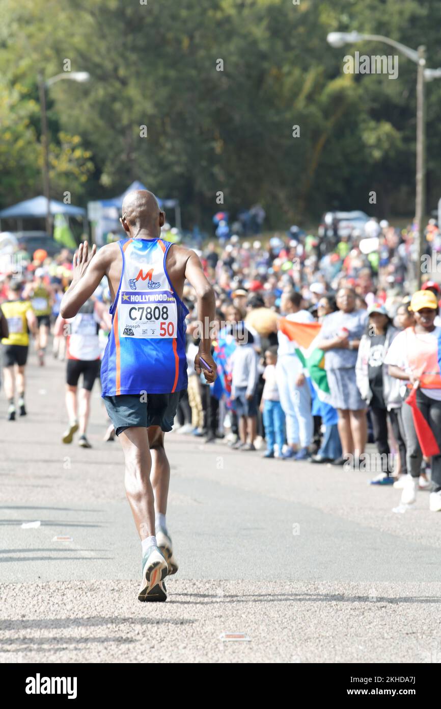 Adult man running, sport event, 95th Comrades Marathon 2022, rear view ...