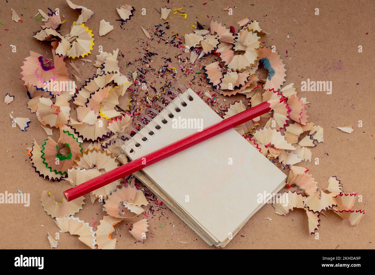 Color pencil on spiral notebooks with pencil trash Stock Photo - Alamy