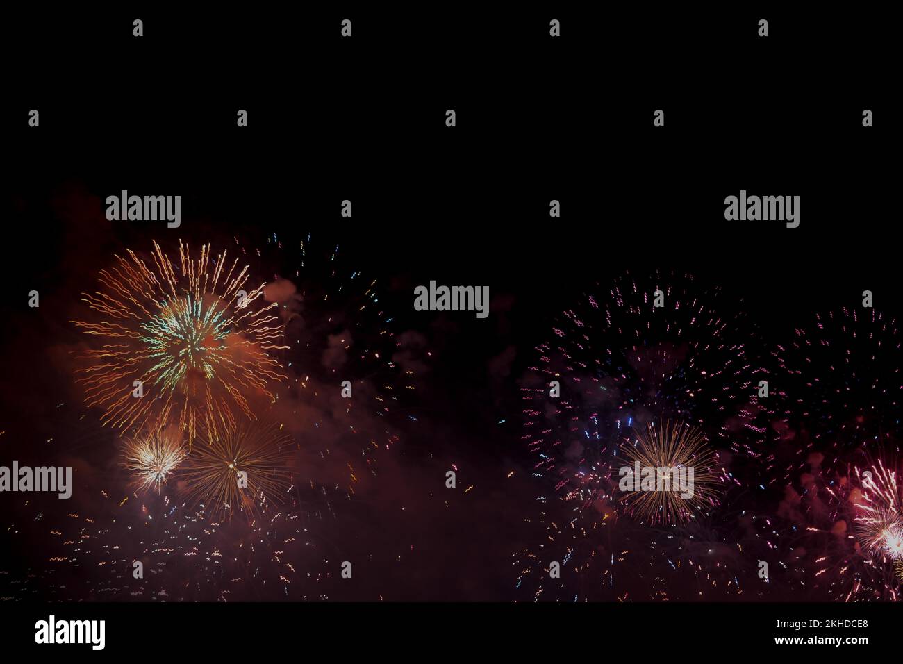Festive colour firework background at a dark night Stock Photo - Alamy