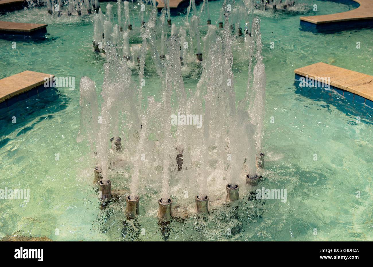The fountains gushing sparkling water in a pool in a park Stock Photo ...