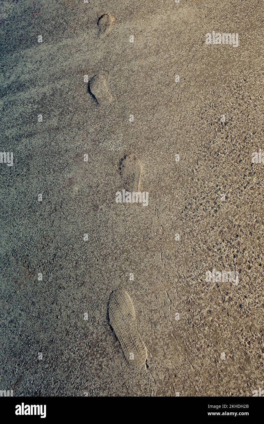 Footstep pattern seen on a concrete background Stock Photo - Alamy