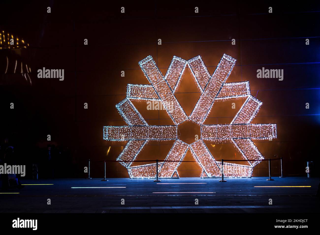 Large white snowflake model on a wall outdoors Stock Photo - Alamy