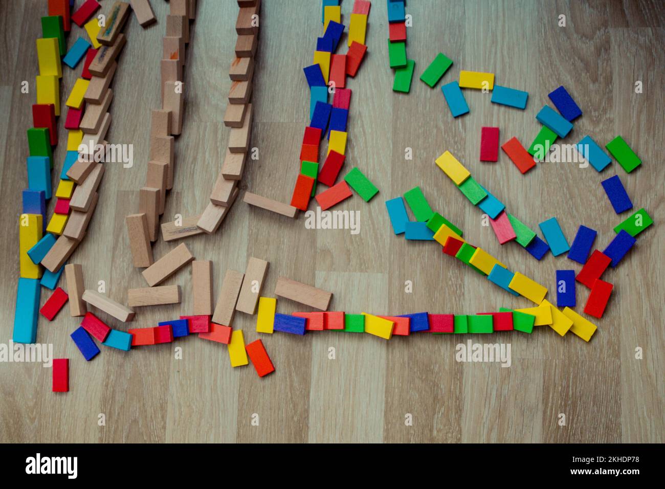 Colorful Domino Blocks in a line on a white background Stock Photo - Alamy