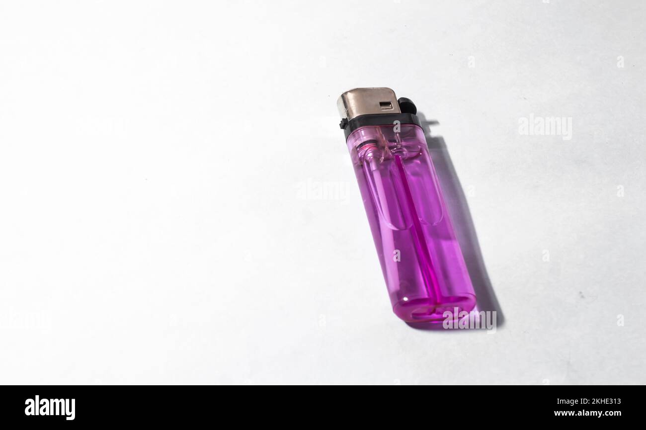 Purple lighter with white background for clipping Stock Photo - Alamy