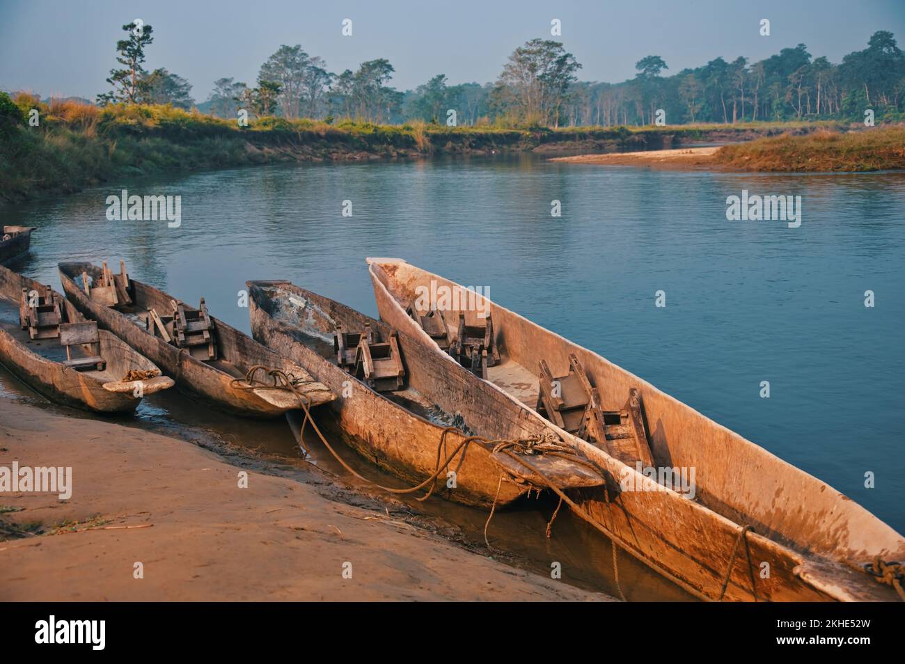 Closeup of traditional wooden boats in Chitwan National Park, Nepal ...