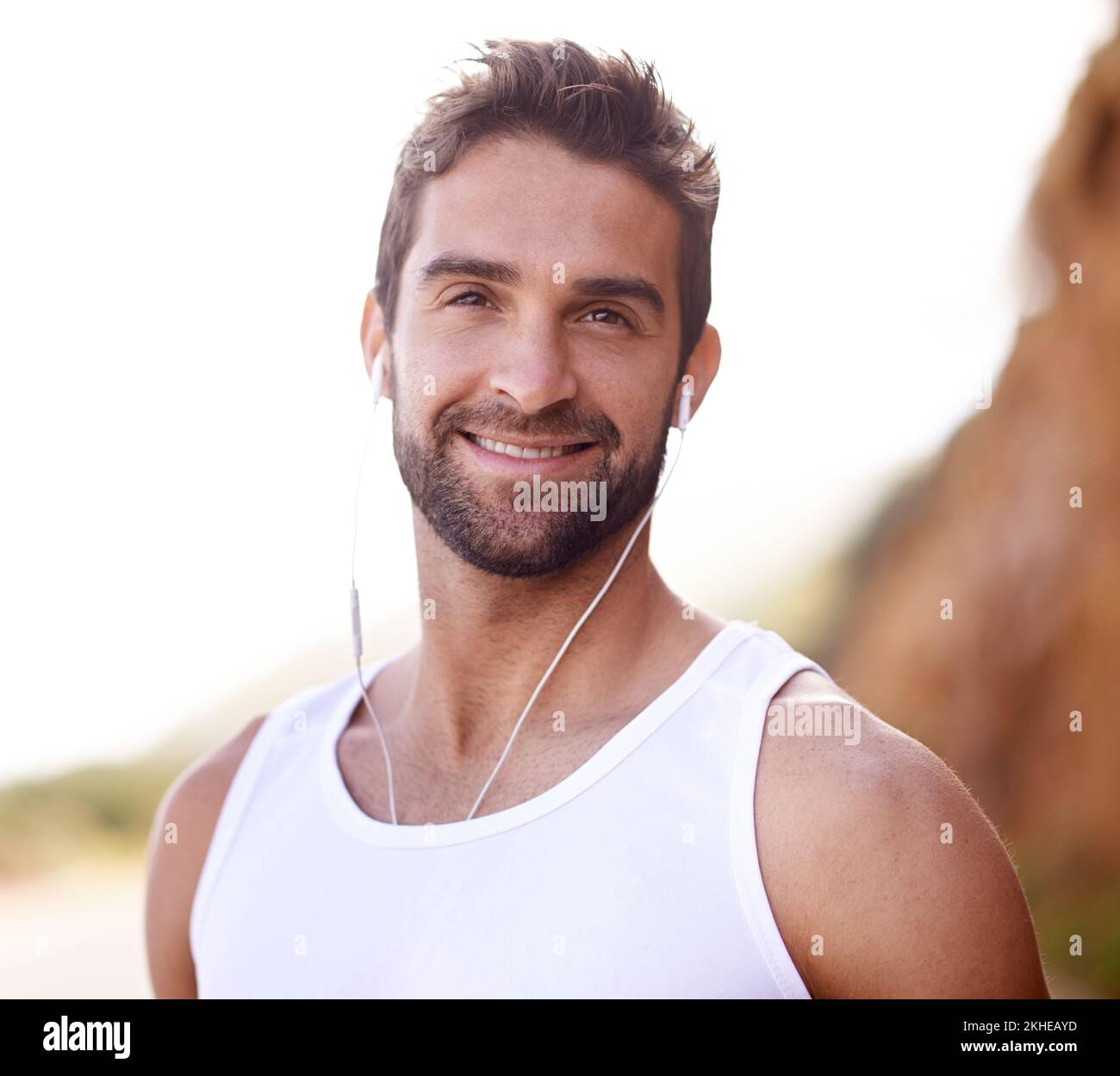Time for a relaxing run. a handsome young man standing outdoors with ...