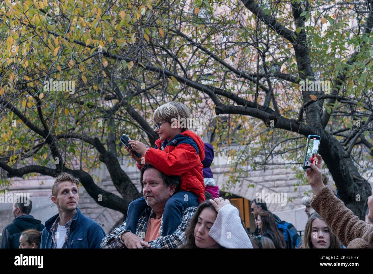 People watch balloons inflation for 96th Macy's Thanksgiving Day Parade ...