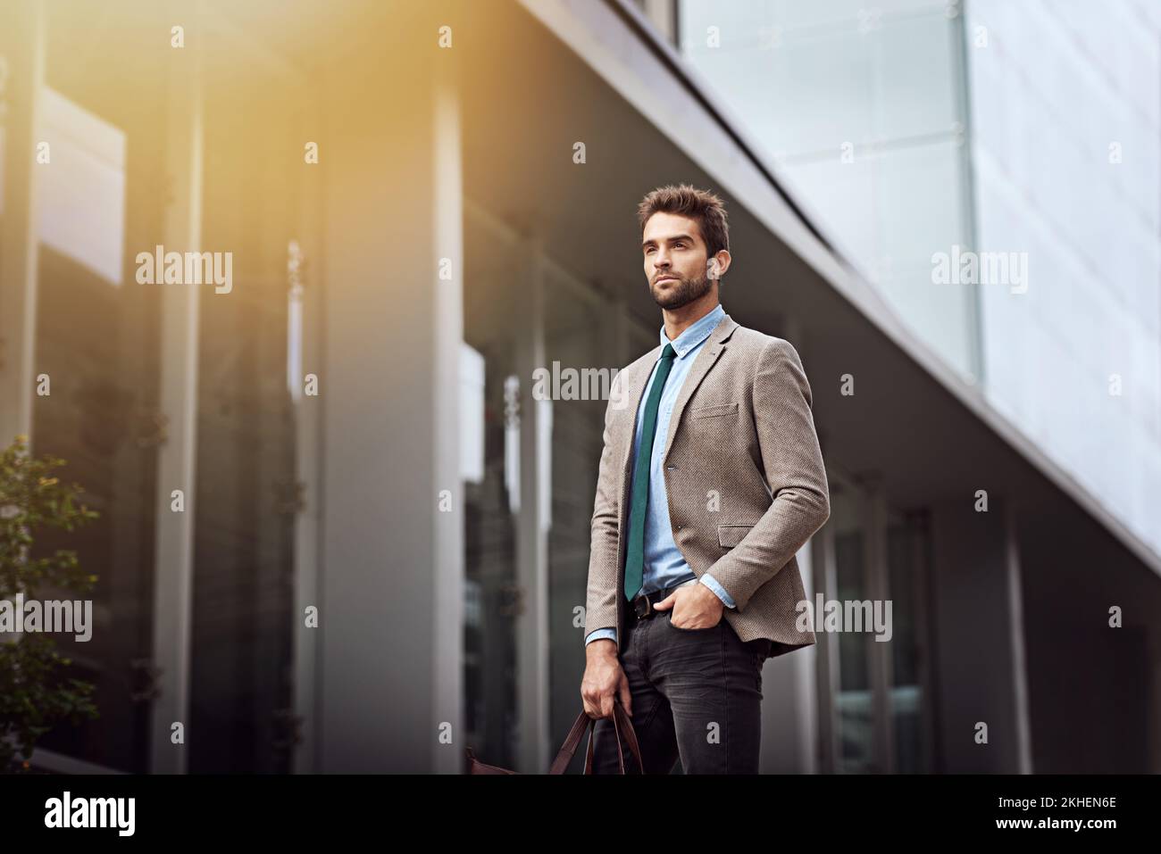 Metropolitan man. a handsome and stylish young businessman in an urban ...