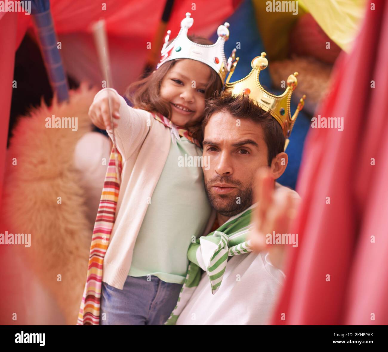 Having so much fun. A cute little girl dressed up as a princess while ...