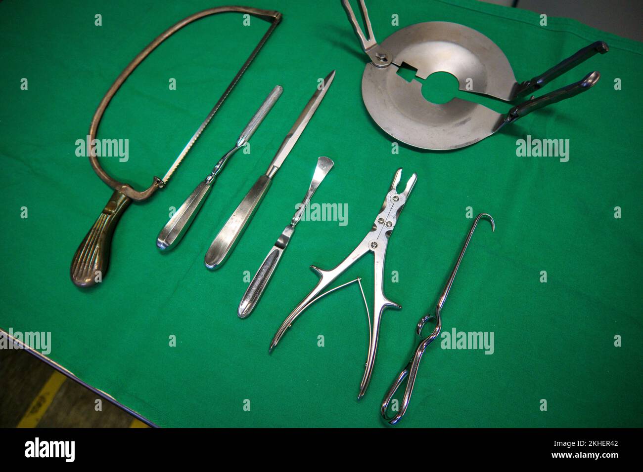 some various instruments for an amputation lie on a surgical cloth ...