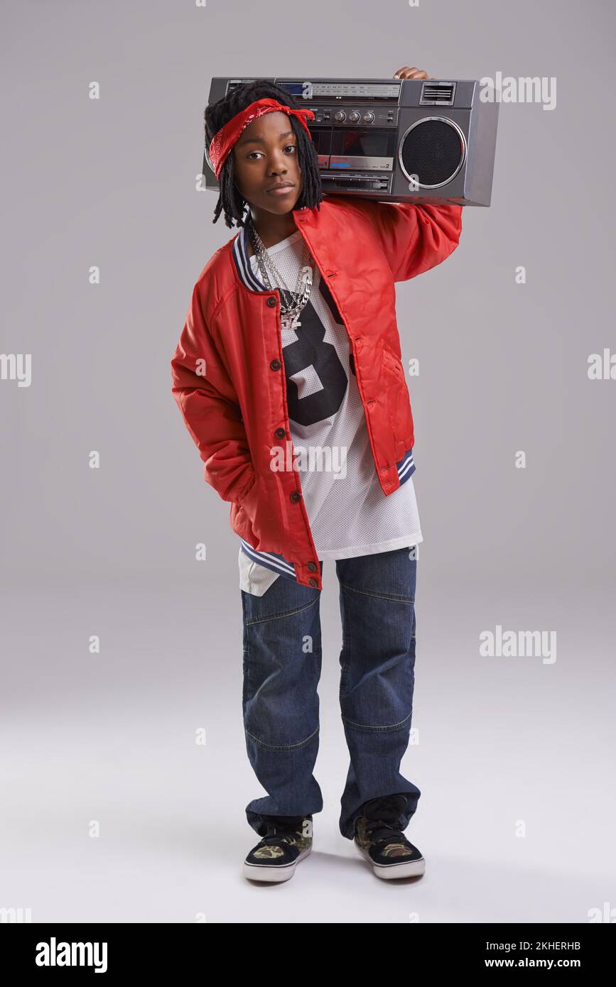 Funky monkey. Studio shot of a young boy dressed in hip hop attire ...