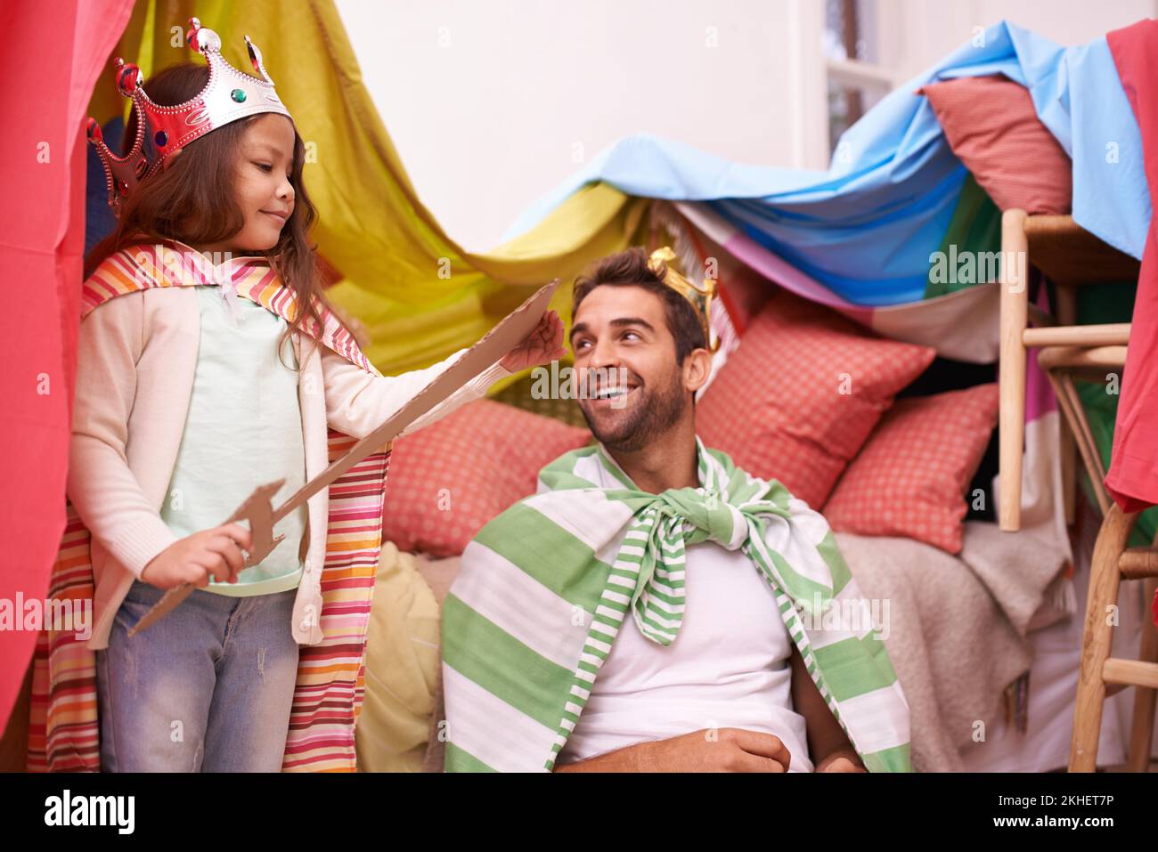 Having so much fun. A cute little girl dressed up as a princess while ...