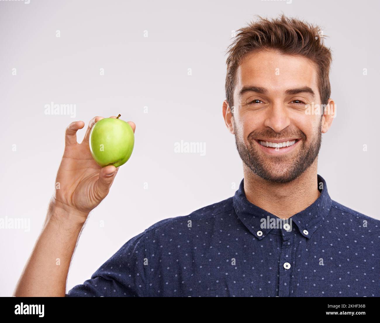Handsome young man holding hi-res stock photography and images - Alamy