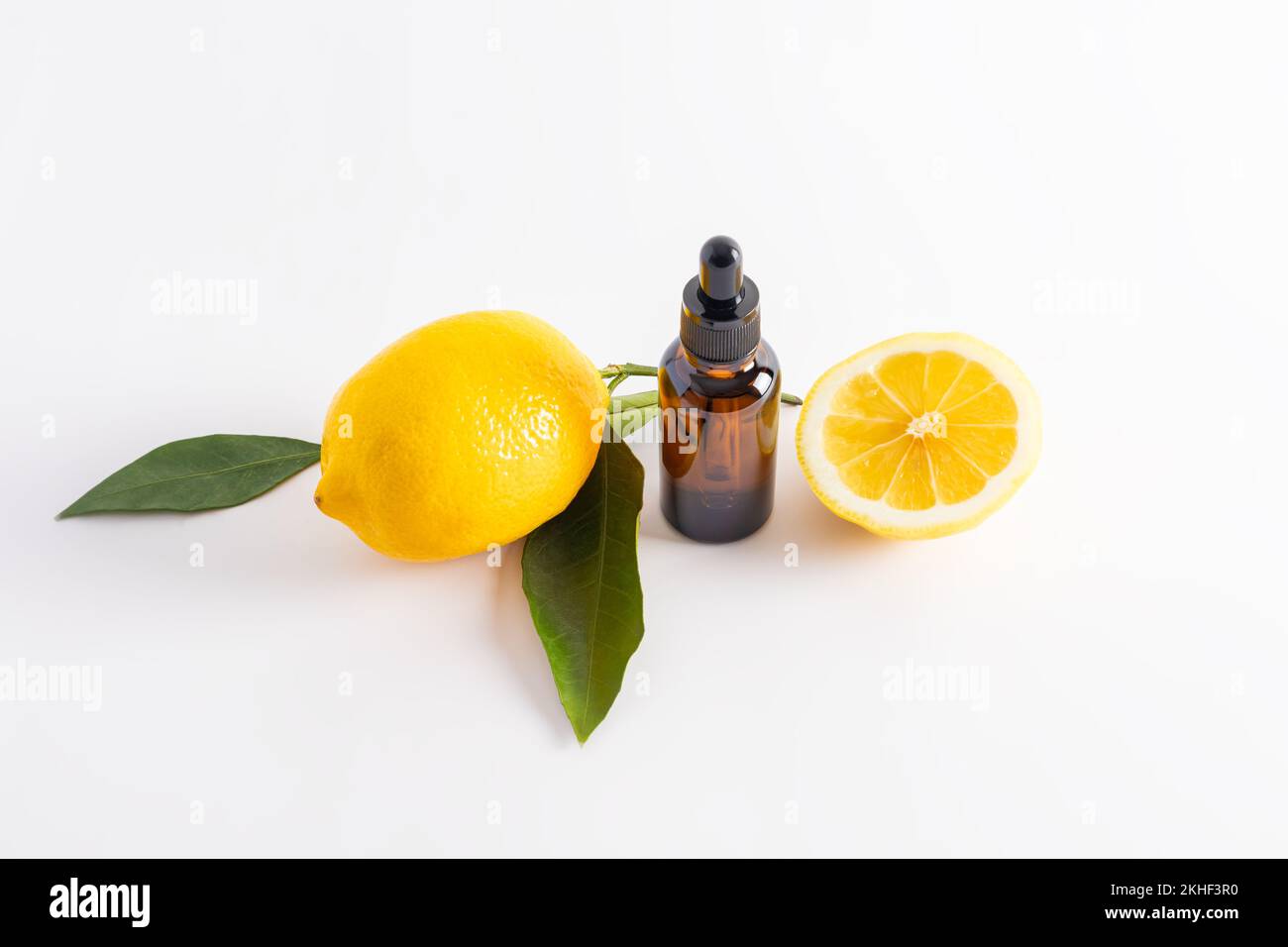 a cosmetic, a serum based on lemon essential oil on a white background ...