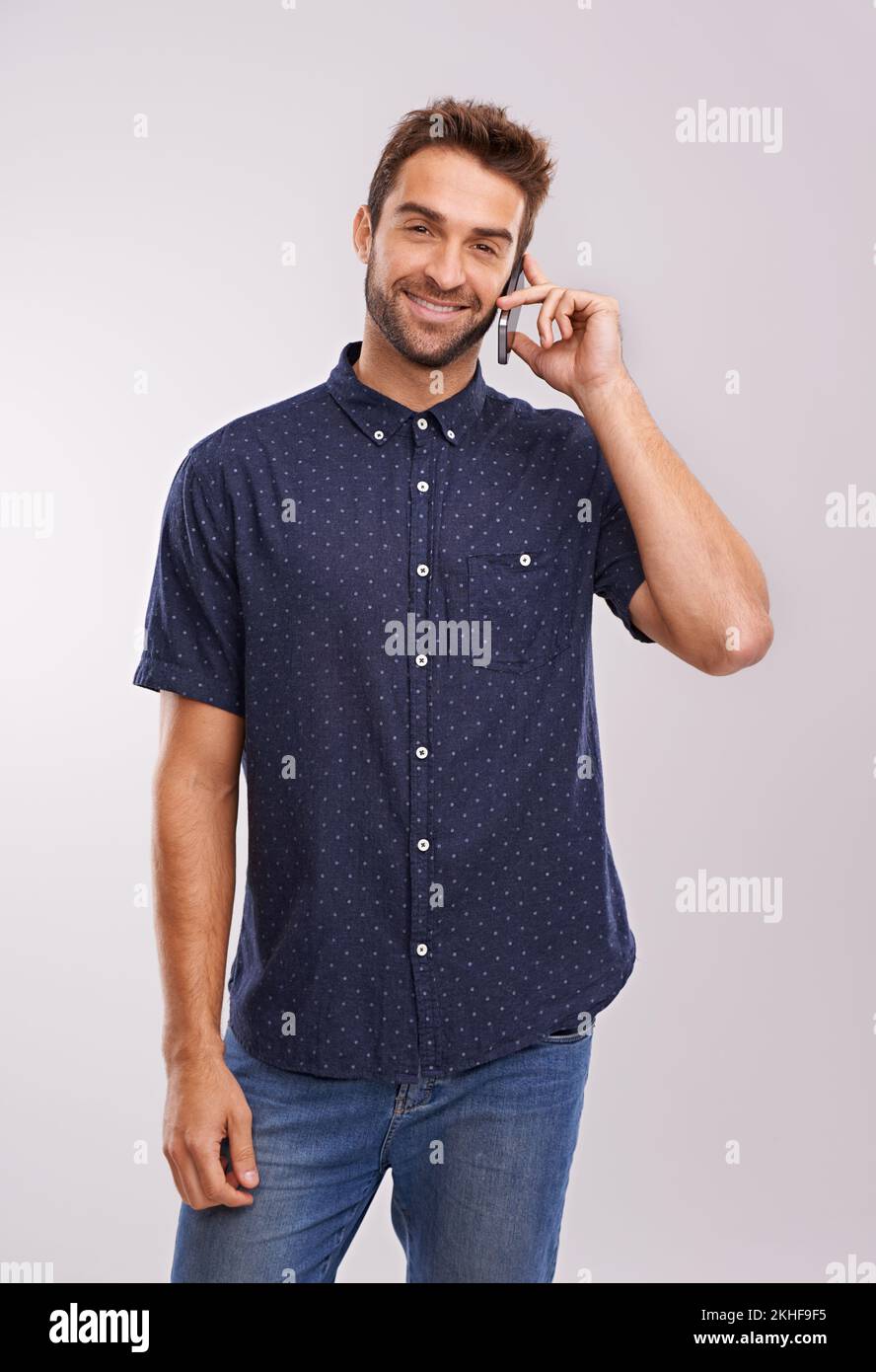 Youre talking to Mr Handsome. A handsome man smiling while taking a ...